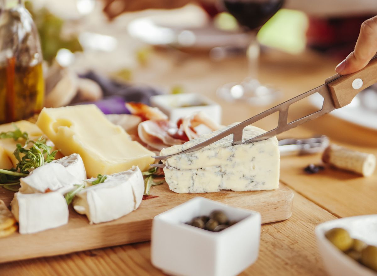 12 Side Effects of Eating Too Much Cheese, According to Experts