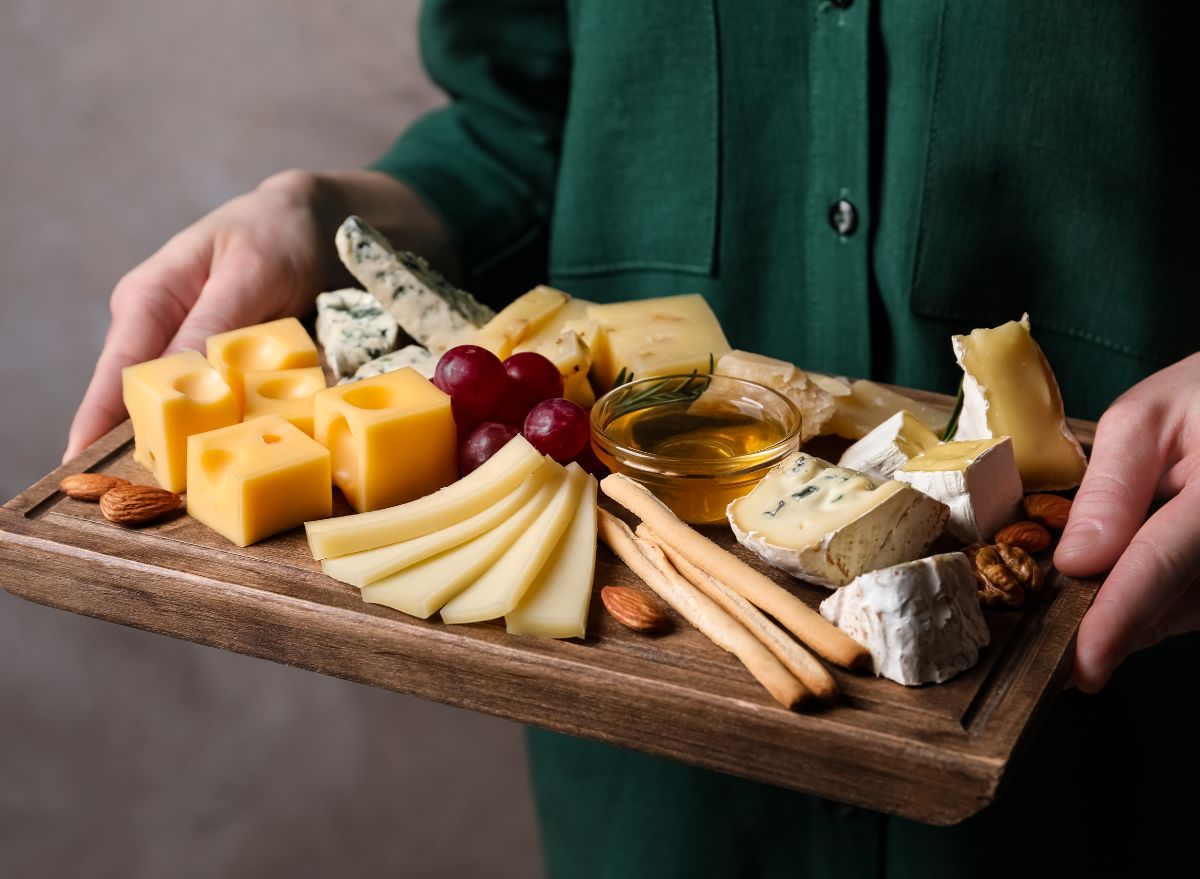 12 Side Effects of Eating Too Much Cheese, According to Experts