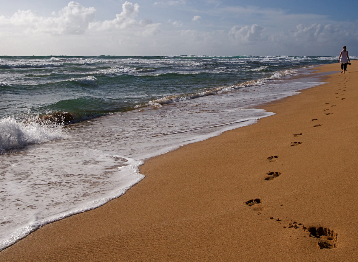 10 Ways To Turn Your Beach Walk into a Full-Body Workout